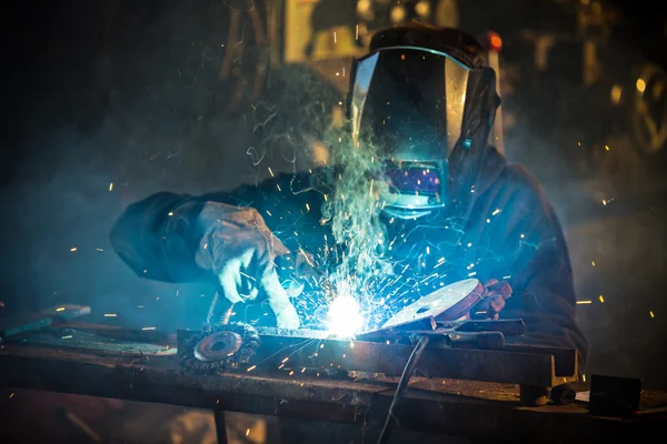Welder in action with bright sparks. - Stock Image - Everypixel