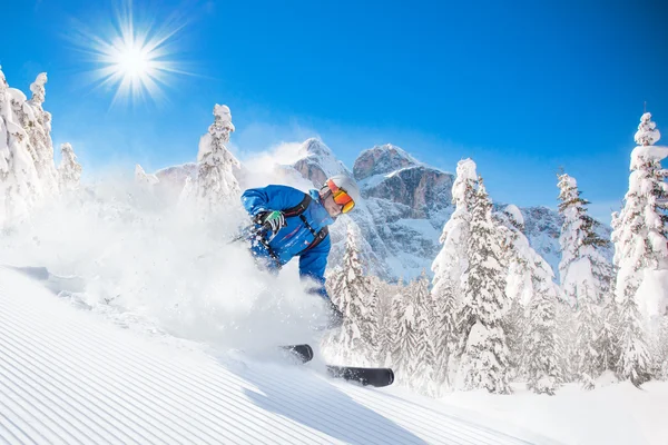 Skier skiing downhill in high mountains - Stock Image - Everypixel