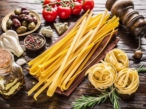 Pasta spaghetti, vegetables, spices and oil. Stock Photo by ©Valentyn ...