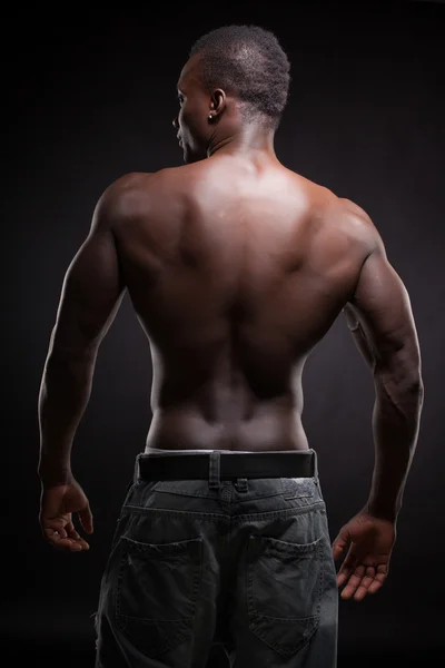 Beautiful and muscular black man in dark background Stock Photo by ...