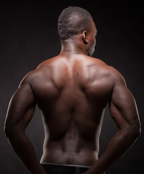 Beautiful and muscular black man in dark background Stock Photo by ...