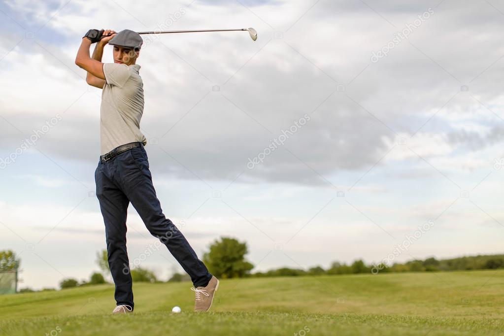 Young man playing golf Stock Photo by ©boggy22 60994373