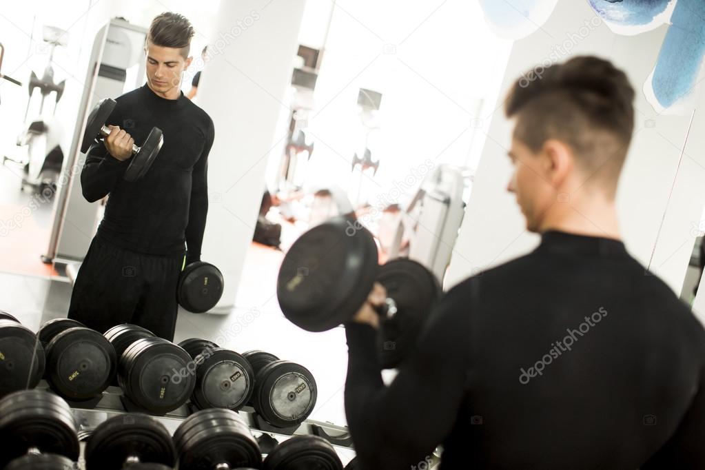Man training in the gym — Stock Photo © boggy22 #85631650
