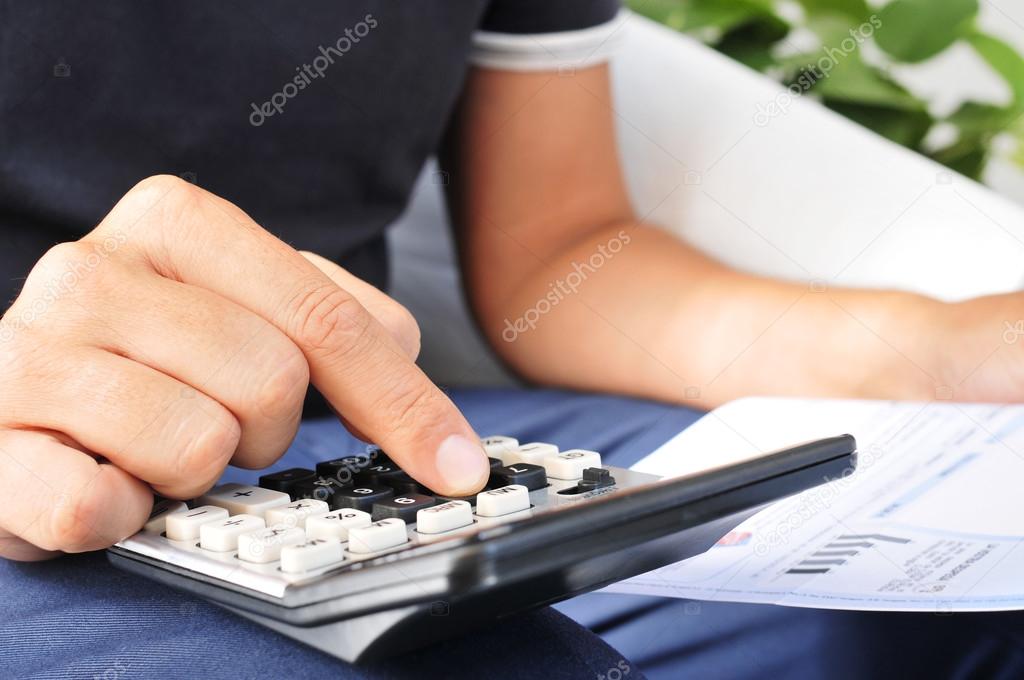 Young man checking a bill, a budget or a payroll — Stock Photo ...
