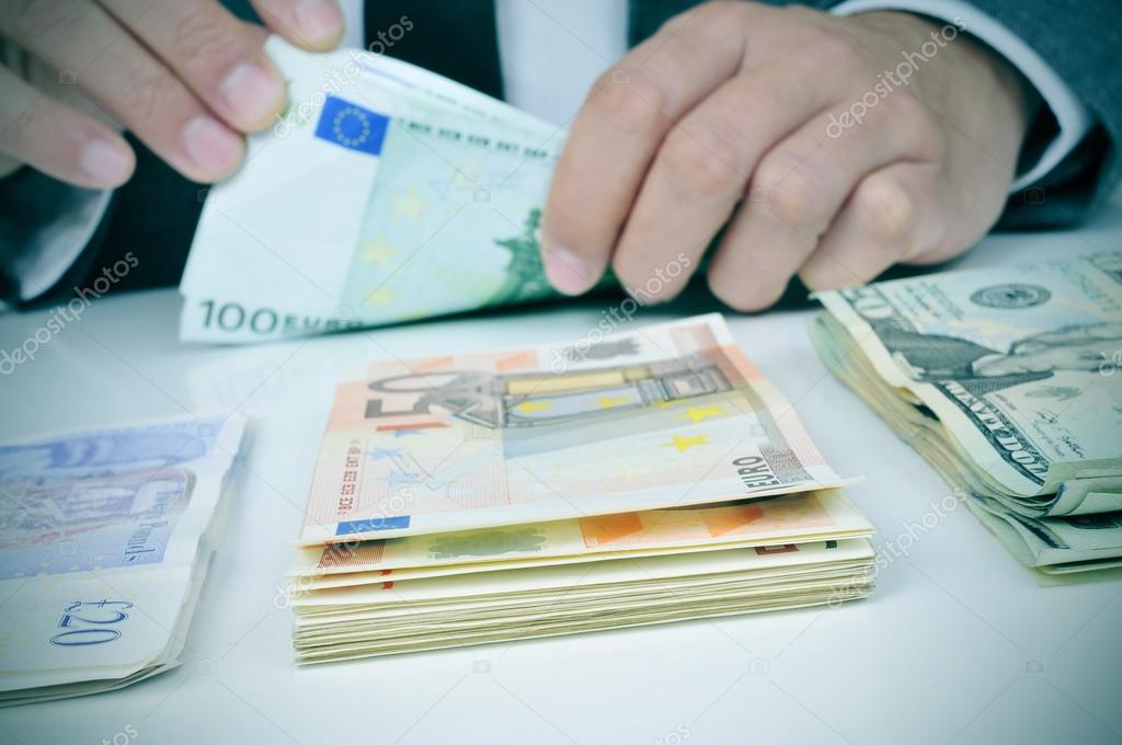 Man counting banknotes Stock Photo by ©nito103 66491301
