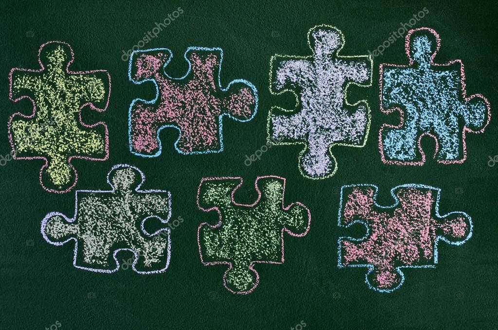 Puzzle pieces of different colors on a chalkboard — Stock Photo ...