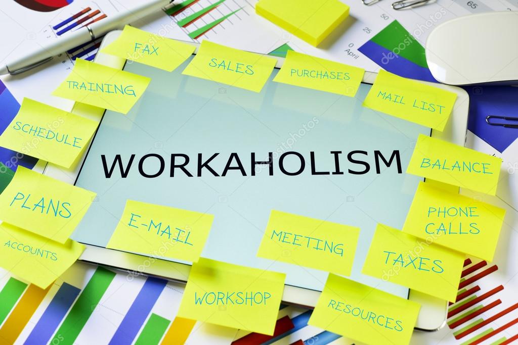 The text workaholism in a tablet on an office desk Stock Photo by ...
