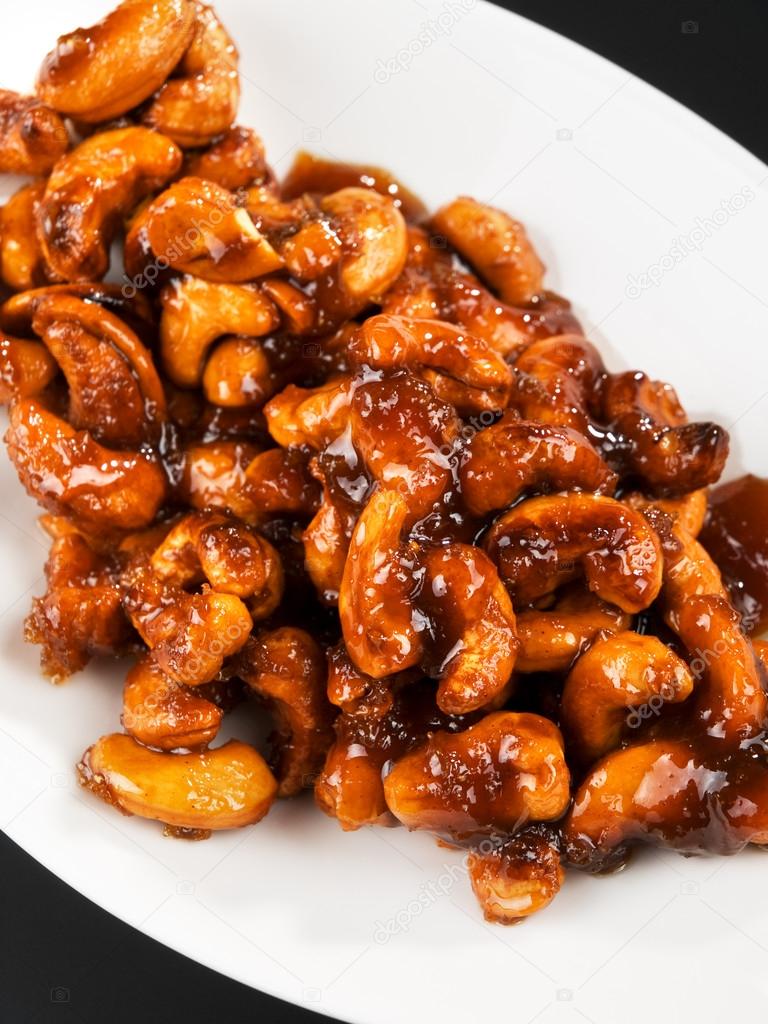 Caramelized cashew nuts Stock Photo by ©ivanmateev 62179705
