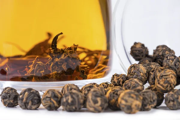 Tea black dragon pearl tea leaves in a teapot, shallow DOF - Stock ...