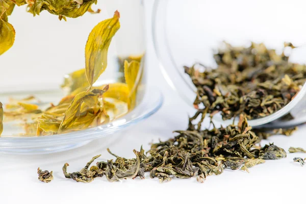 close-up of spilled tea Bao Zhong Oolong Tea and brewed tea in a ...