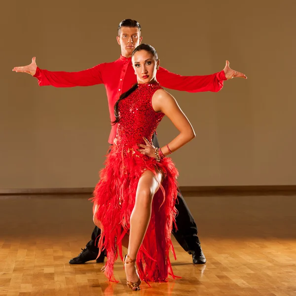 Latino dance couple in action - dancing wild samba — Stock Photo ...