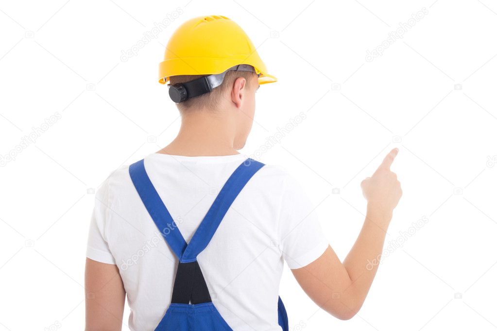 Back view of man in builder uniform and helmet pointing at some — Stock ...