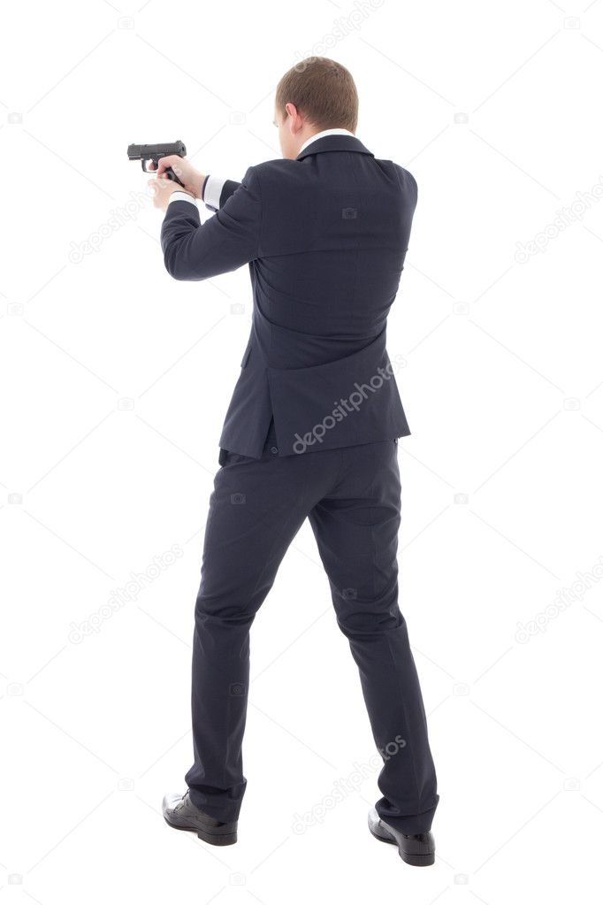 Back view of special agent man in business suit posing with gun Stock ...