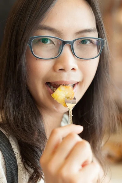 Woman eat bread. - Stock Image - Everypixel