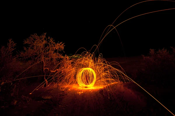 Fire painting, light painting with sparks at winter - Stock Image ...