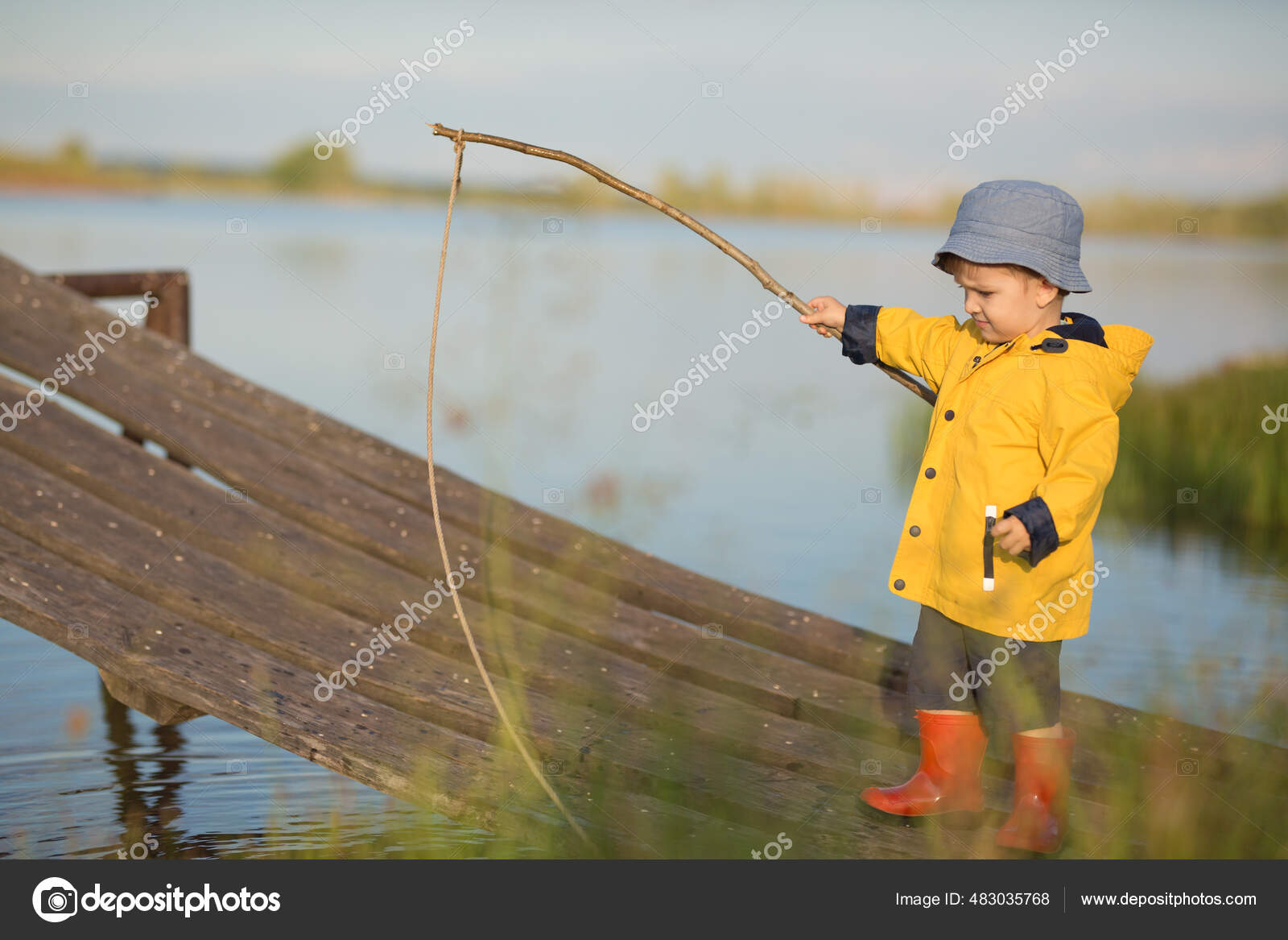Little Boy Catching a Fish from wooden dock Stock Photo by ©Mulikov ...