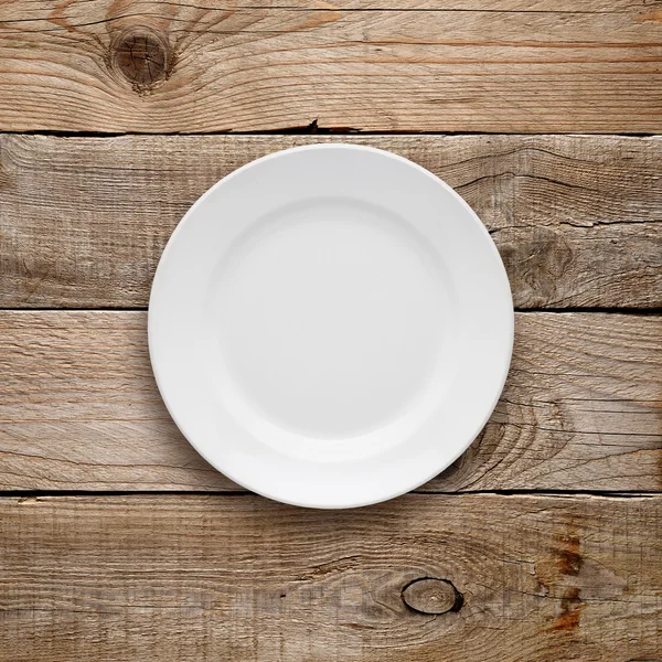 Empty plate top view on table Stock Photo by ©windujedi 110314174