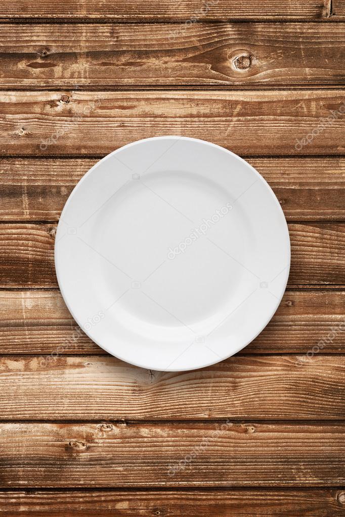 Empty plate top view on table Stock Photo by ©windujedi 110314174