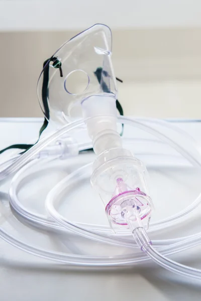 Oxygen mask for asthma treatment on table at hospital room. - Stock ...