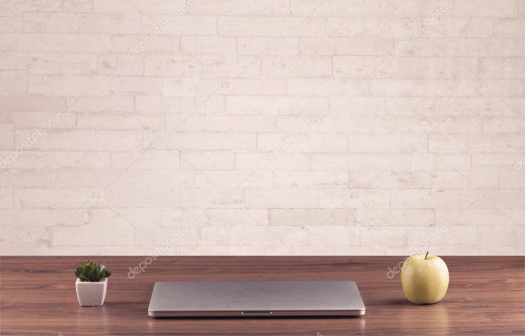 Office desk closeup with white brick wall Stock Photo by ©ra2studio ...