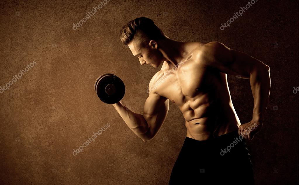 Muscular fit bodybuilder athlete lifting weight Stock Photo by ...