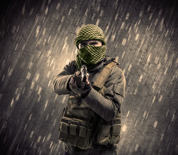 Dangerous armed terrorist with mask and gun in a thunderstorm wi Stock ...