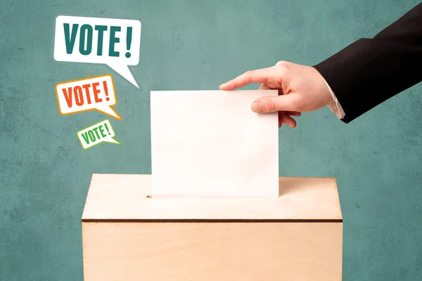 Placing a voting slip into a ballot box — Stock Photo © ra2studio ...