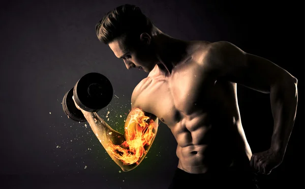 Bodybuilder athlete lifting weight with fire explode arm concept Stock ...