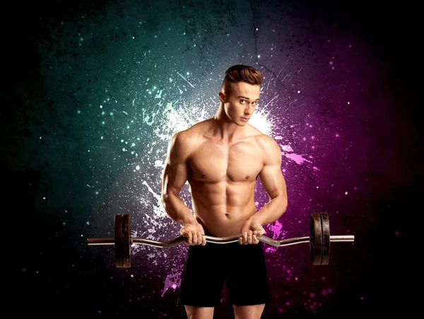 Attractive musculous guy lifting weight - Stock Image - Everypixel