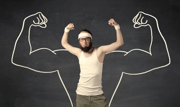 Young weak man with drawn muscles Stock Photo by ©ra2studio 91641214