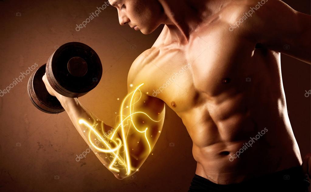 Muscular body builder lifting weight with energy lights on bicep Stock ...