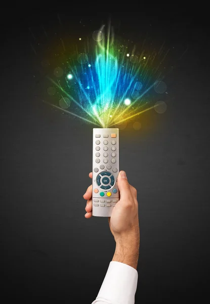 Hand with remote control and explosive signal - Stock Image - Everypixel
