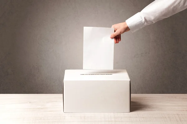 Ballot box with person casting vote Stock Photo by ©ra2studio 108355124
