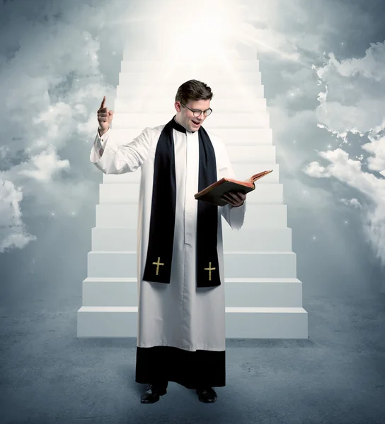 Young priest in giving his blessing - Stock Image - Everypixel