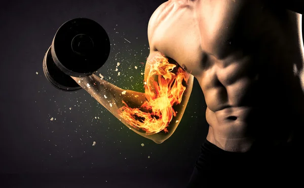 Bodybuilder athlete lifting weight with fire explode arm concept ...