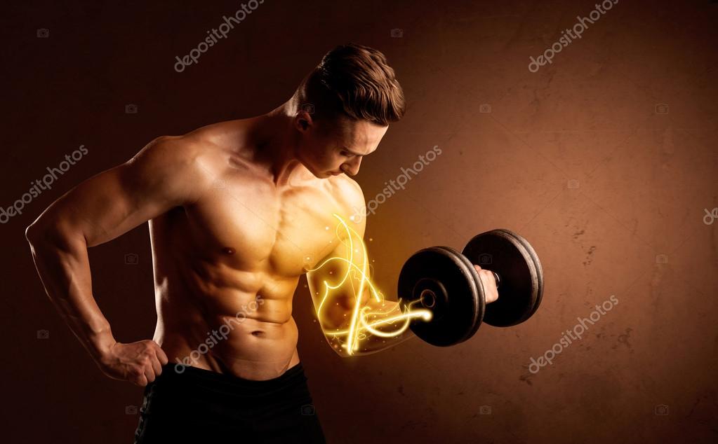 Muscular body builder lifting weight with energy lights on bicep ...