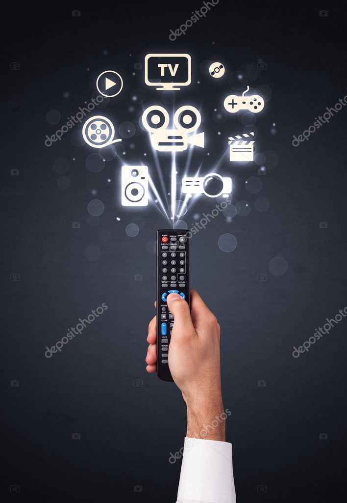 Hand with remote control and media icons — Stock Photo © ra2studio ...