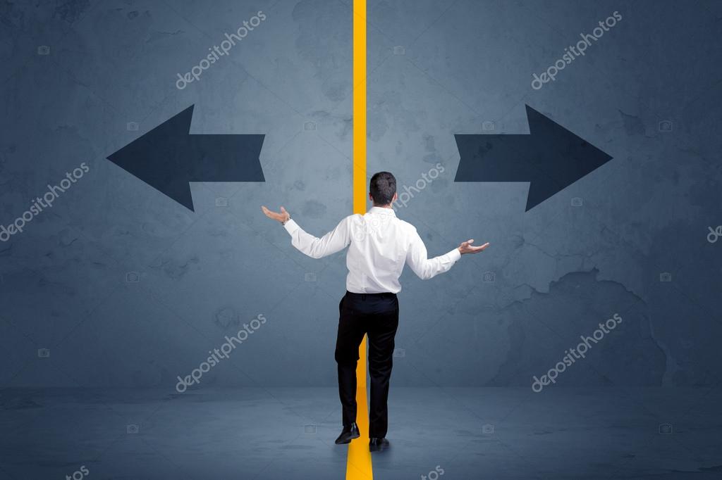 Business person choosing between two options separated by a yell ...