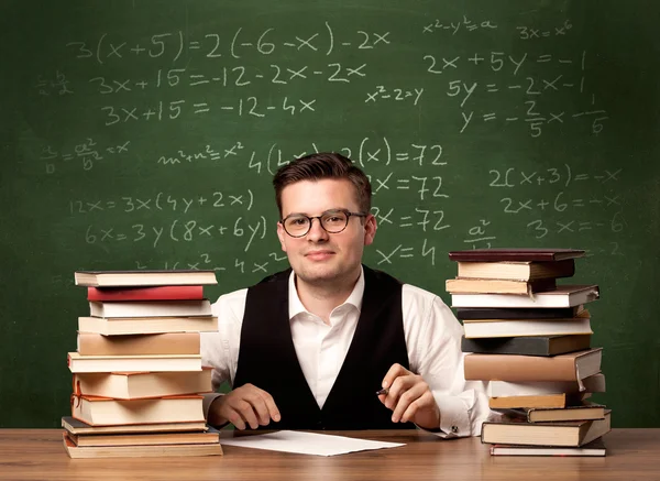 Math teacher at desk - Stock Image - Everypixel