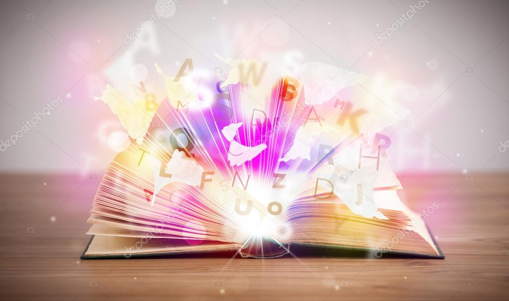 Open book with glowing letters on concrete background Stock Photo by ...