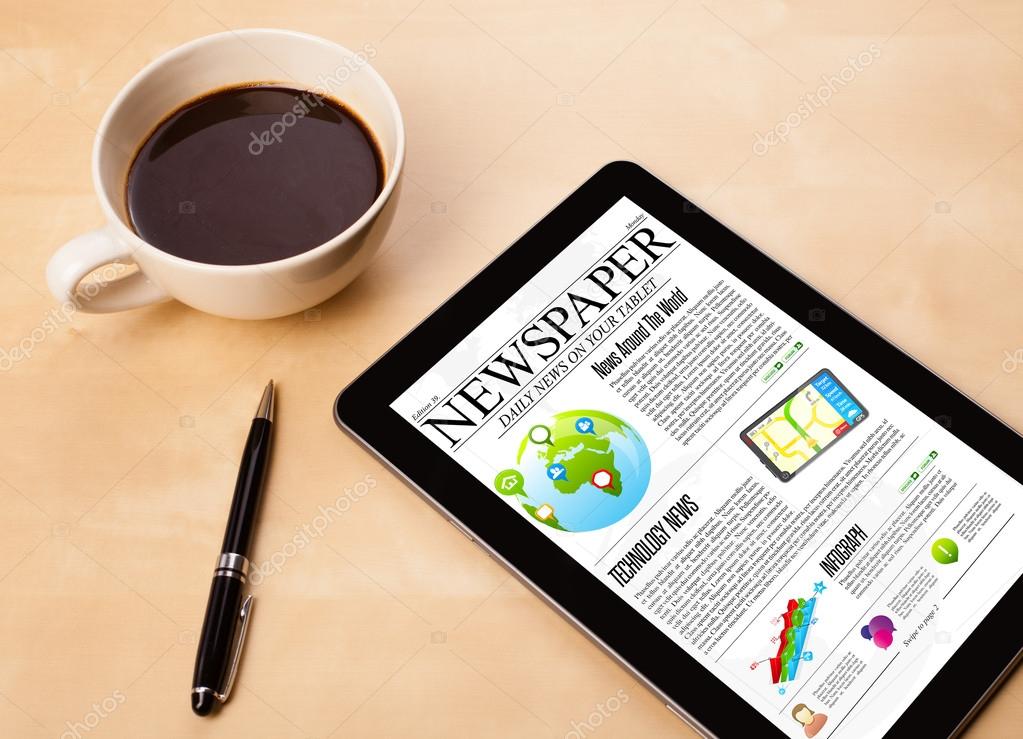 Tablet pc shows news on screen with a cup of coffee on a desk — Stock ...
