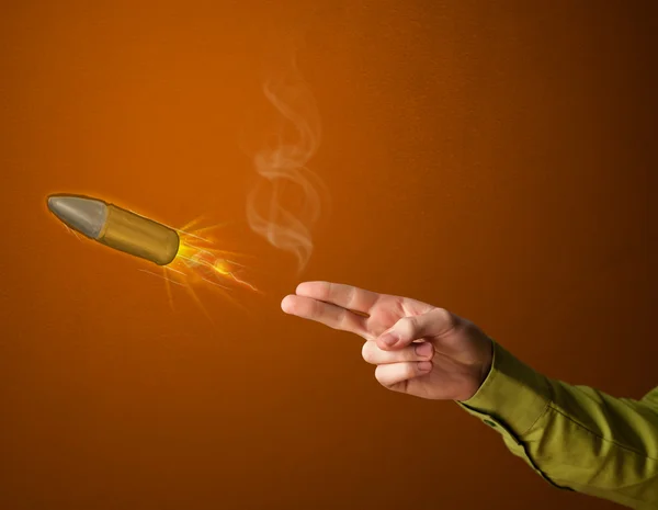 Gun shaped male hand with bullet - Stock Image - Everypixel
