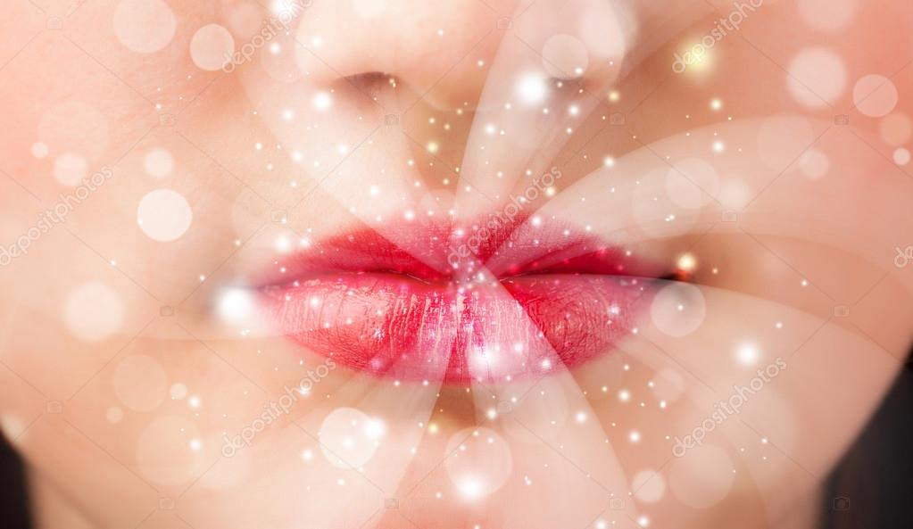 Pretty woman lips blowing abstract white lights — Stock Photo ...