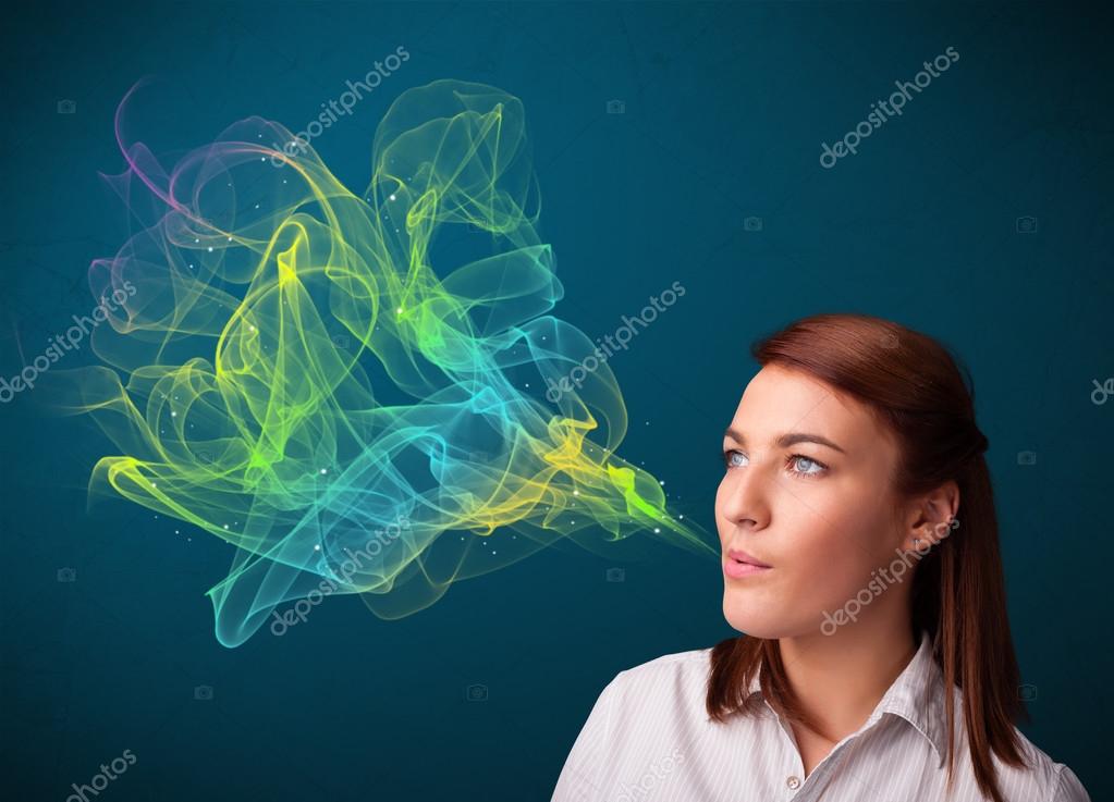 Pretty lady smoking cigarette with colorful smoke Stock Photo by ...