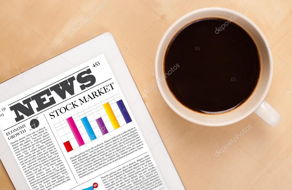 Tablet pc shows news on screen with a cup of coffee on a desk — Stock ...