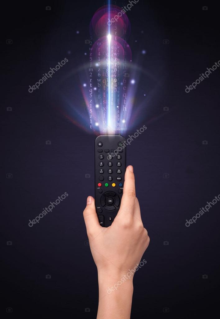 Mano con control remoto y números brillantes — Foto de stock #67891803 ...