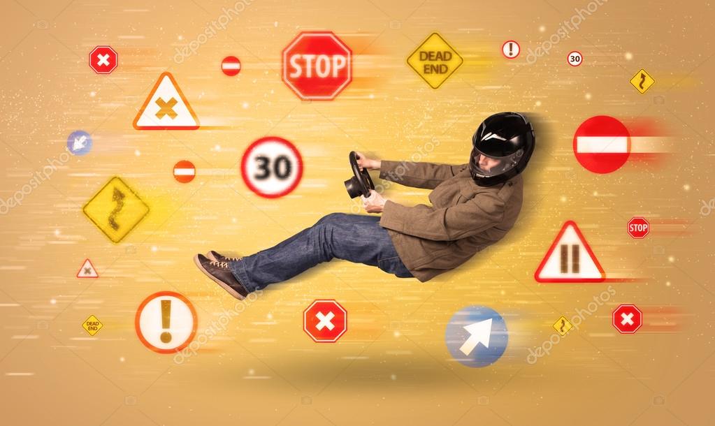 Young driver with road signs around him — Stock Photo © ra2studio #71661807