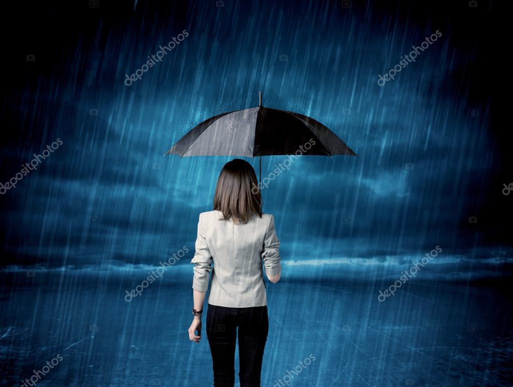 Woman Standing In The Rain
