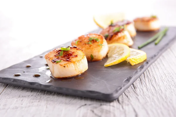 Seared scallop on plate Stock Photo by ©studioM 57461905