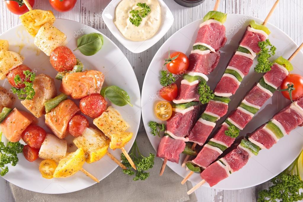 Raw meat and fish on sticks Stock Photo by ©studioM 72130315